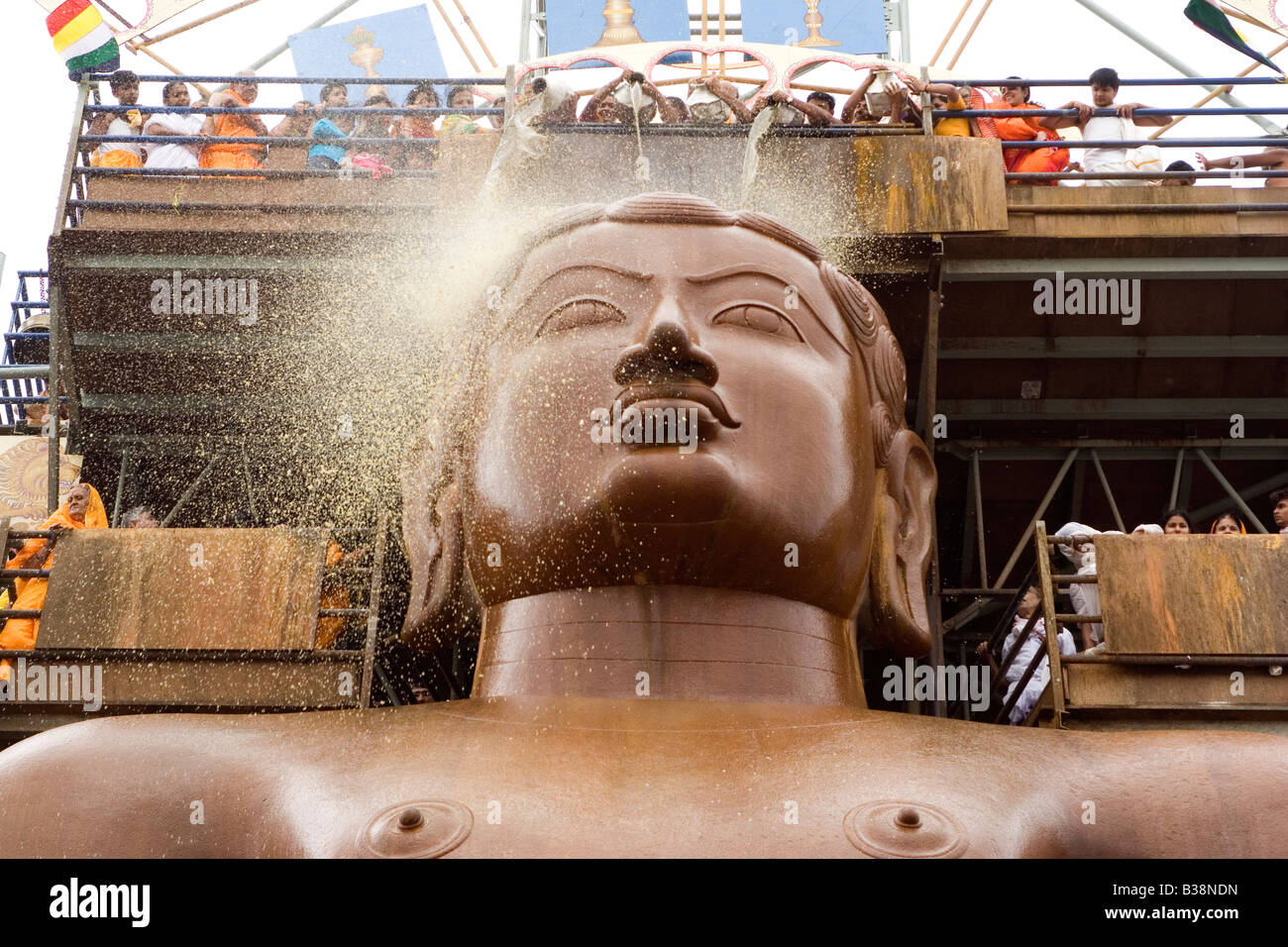 Pilgrims anoint the statue of Lord Bahubali during the ...