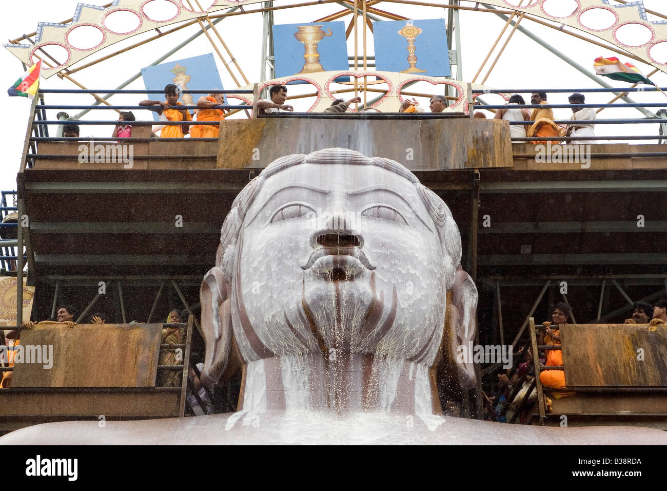 Pilgrims anoint the statue of Lord Bahubali during the ...