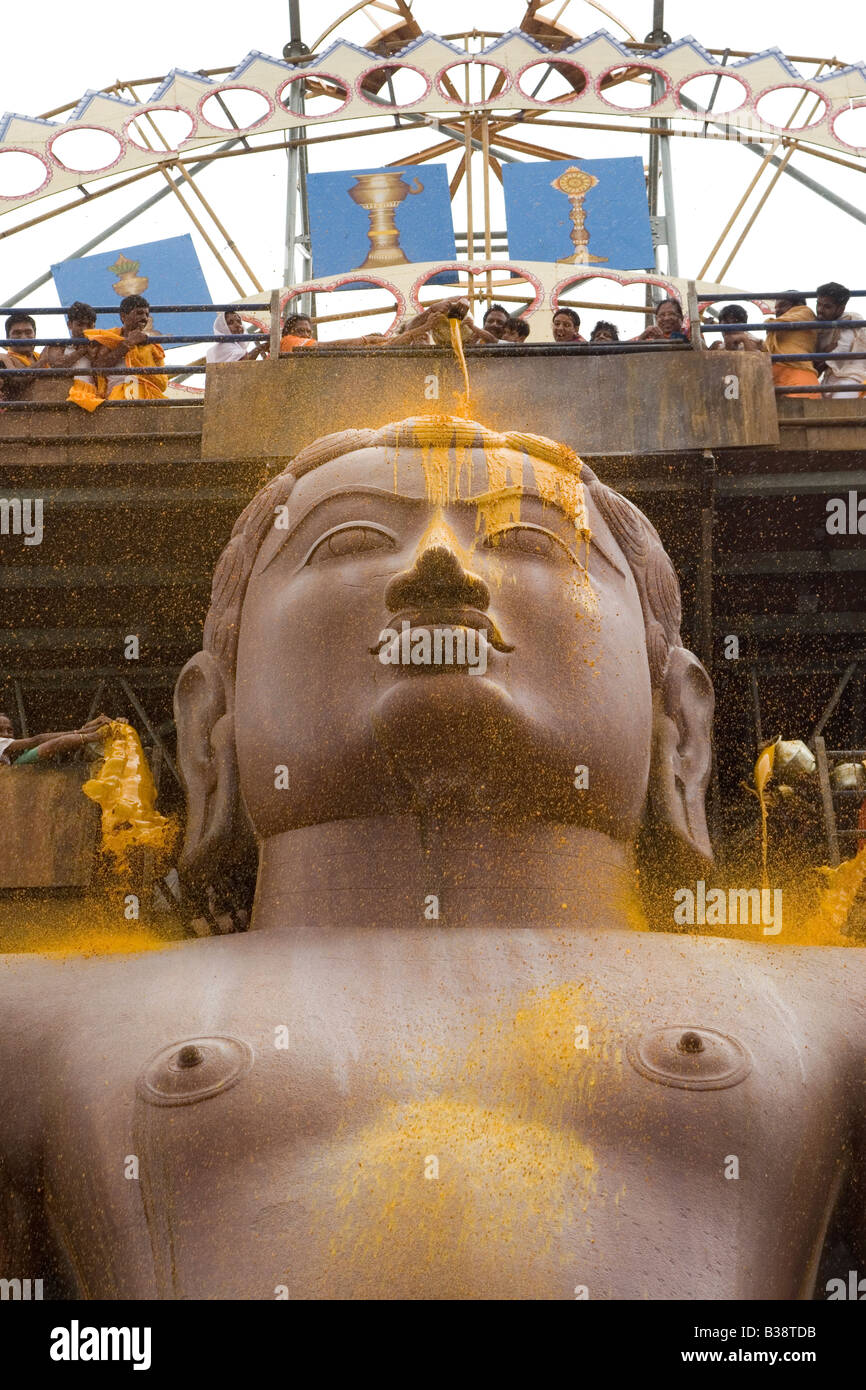 Pilgrims anoint the statue of Lord Bahubali during the ...