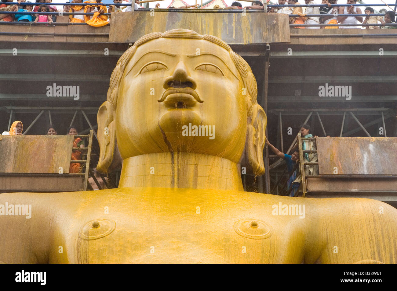 Pilgrims anoint the statue of Lord Bahubali during the ...