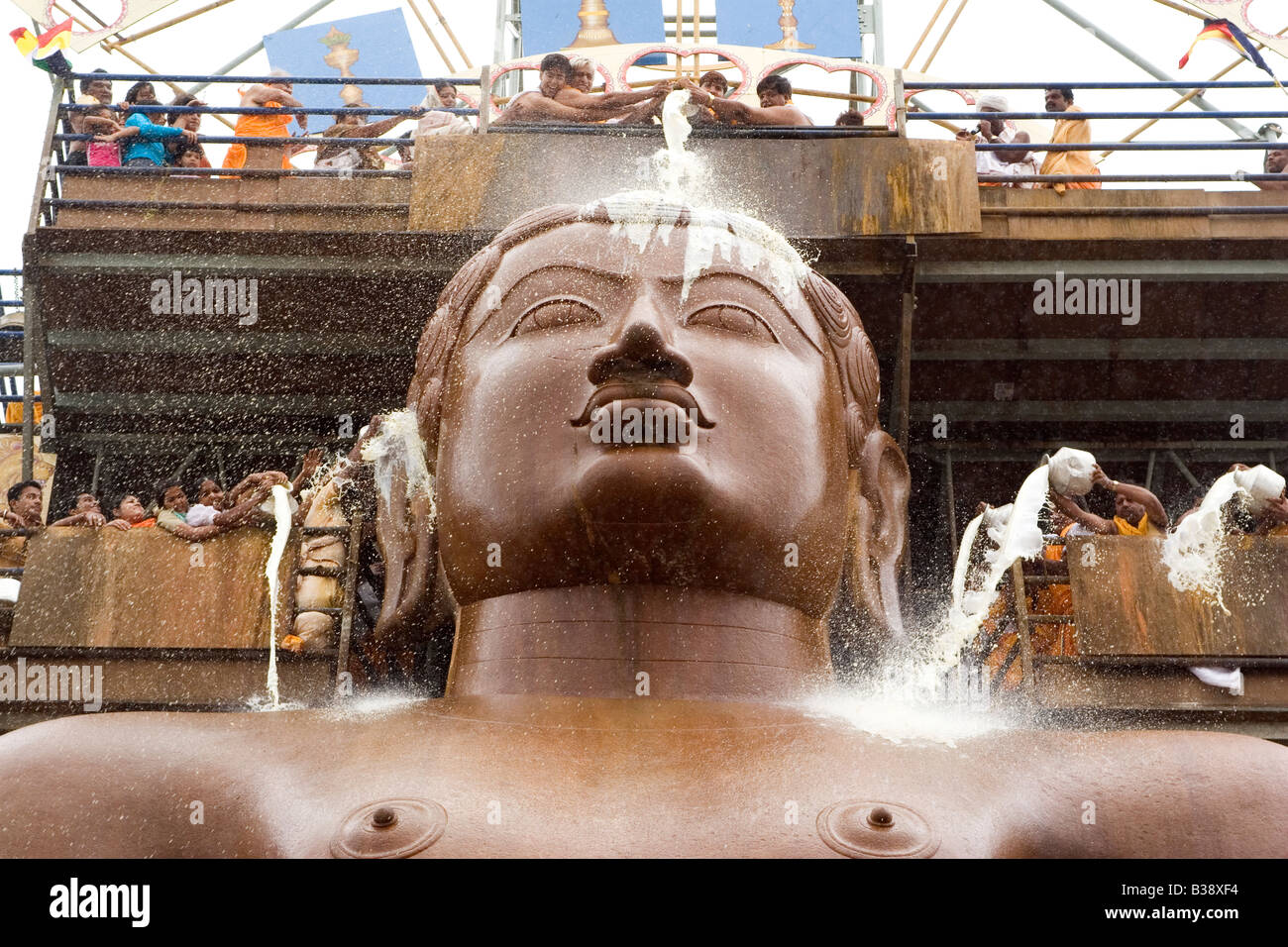 Pilgrims anoint the statue of Lord Bahubali during the ...