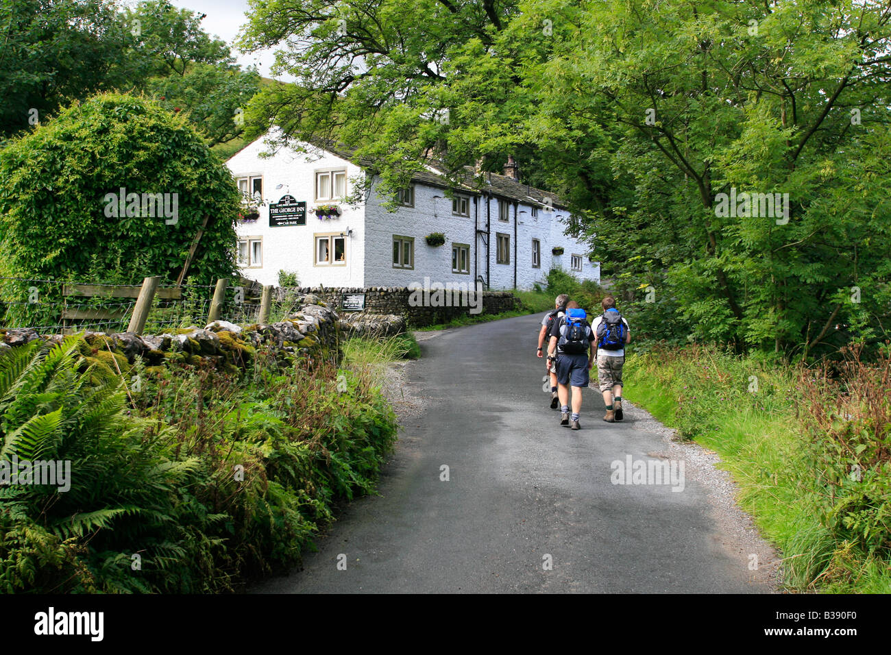 Walkers approach the George pub Hubberholme in the Yorkshire Dales ...