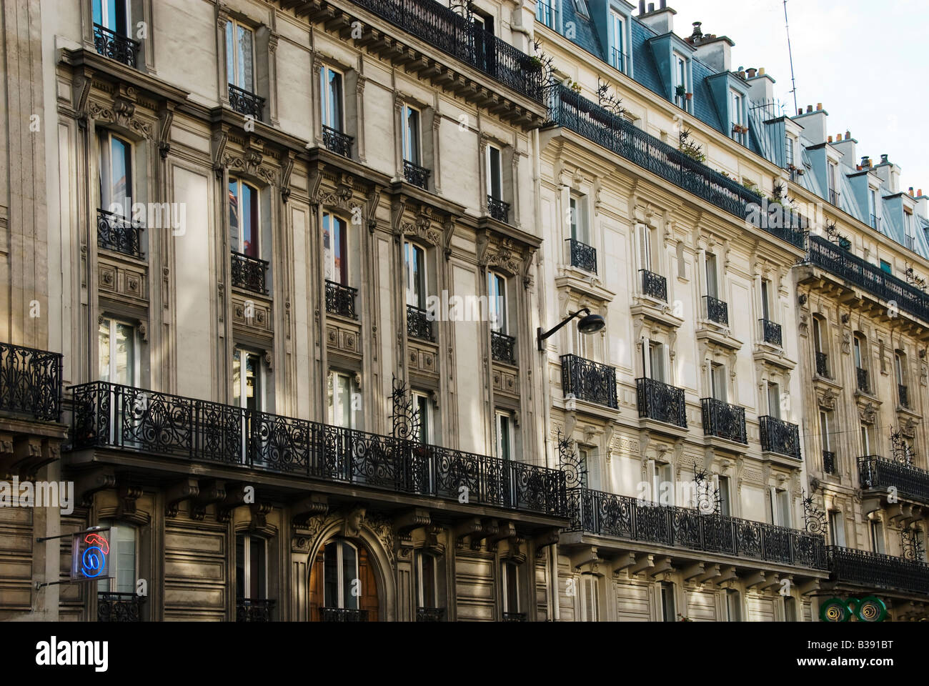 Paris rue facades with telephone and eye glasses signage Stock Photo ...
