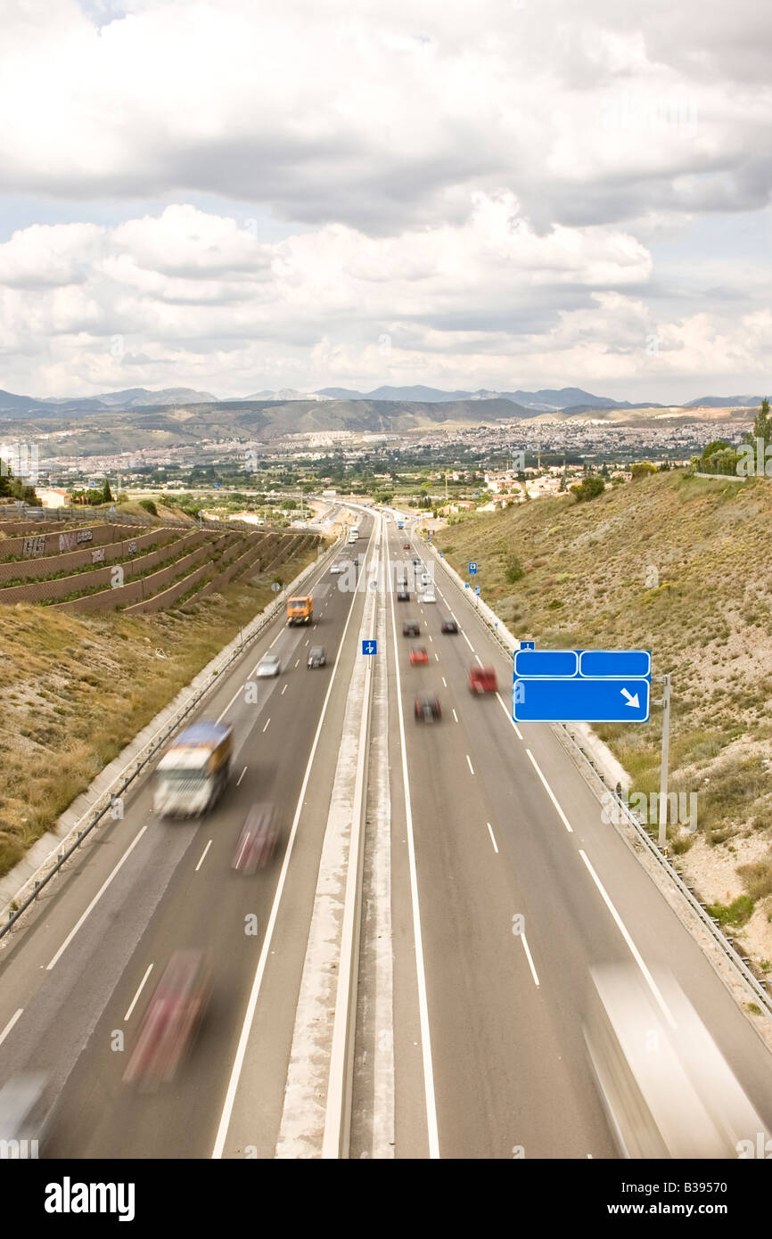 Highway to the city blank blue sign in one side Stock Photo - Alamy