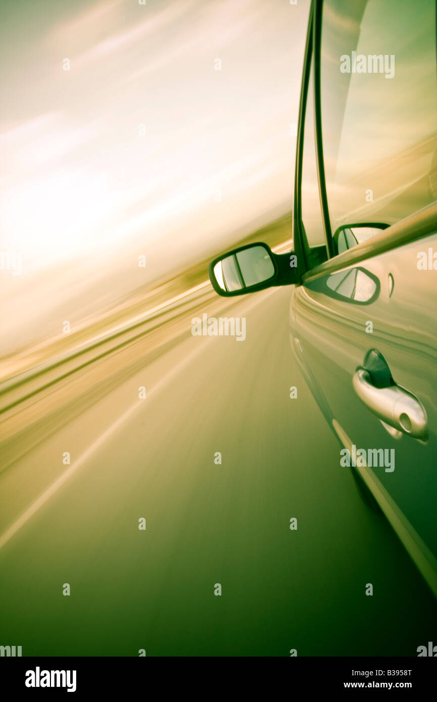 Driving at high speed under sunset colors Stock Photo - Alamy