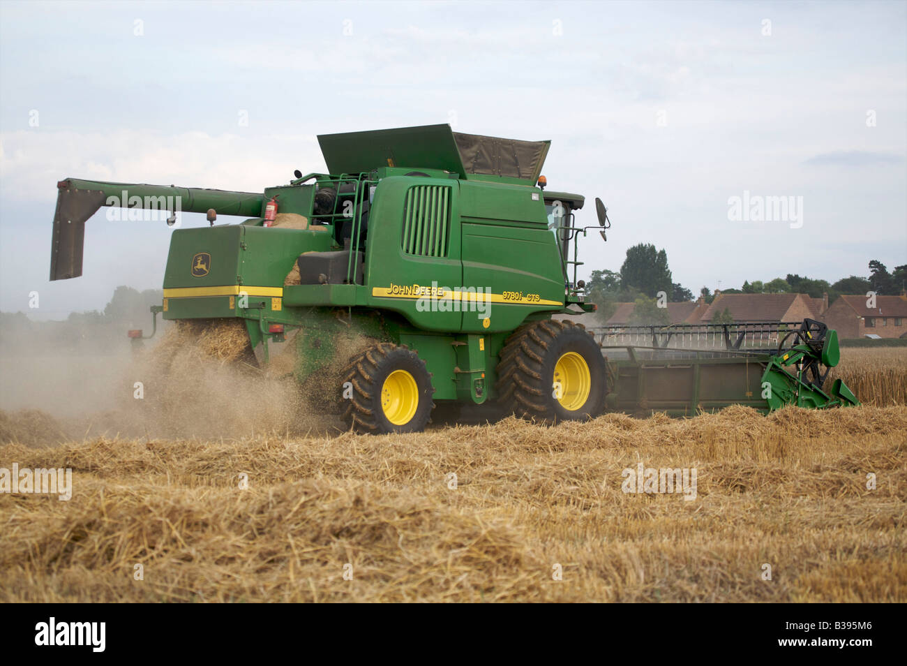 John Deere Combine Harvesting Winter Wheat in dusty conditions Stock ...