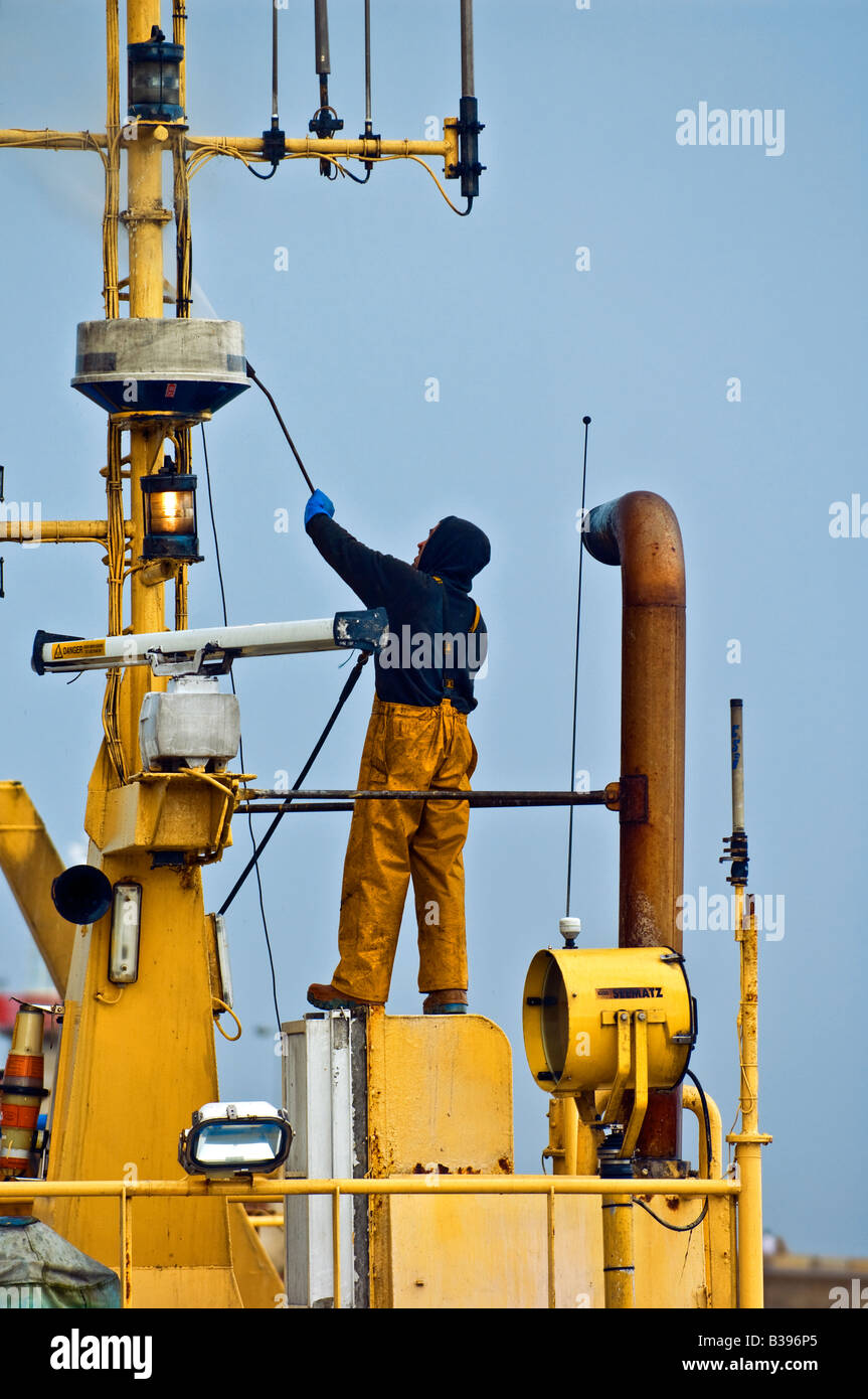 Fisherman working on trawler Stock Photo - Alamy