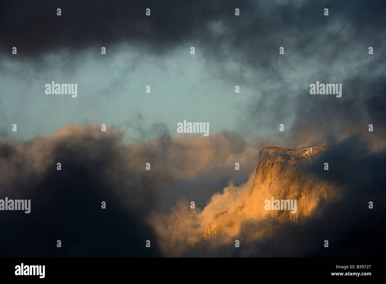 Half Dome emerges from storm clouds Yosmeite National Park California ...