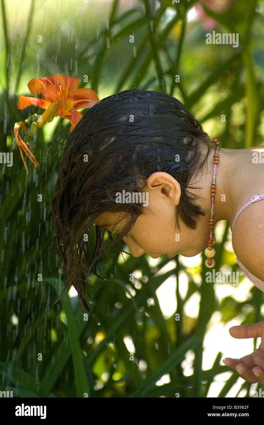 Girl showering in garden hi-res stock photography and images - Alamy