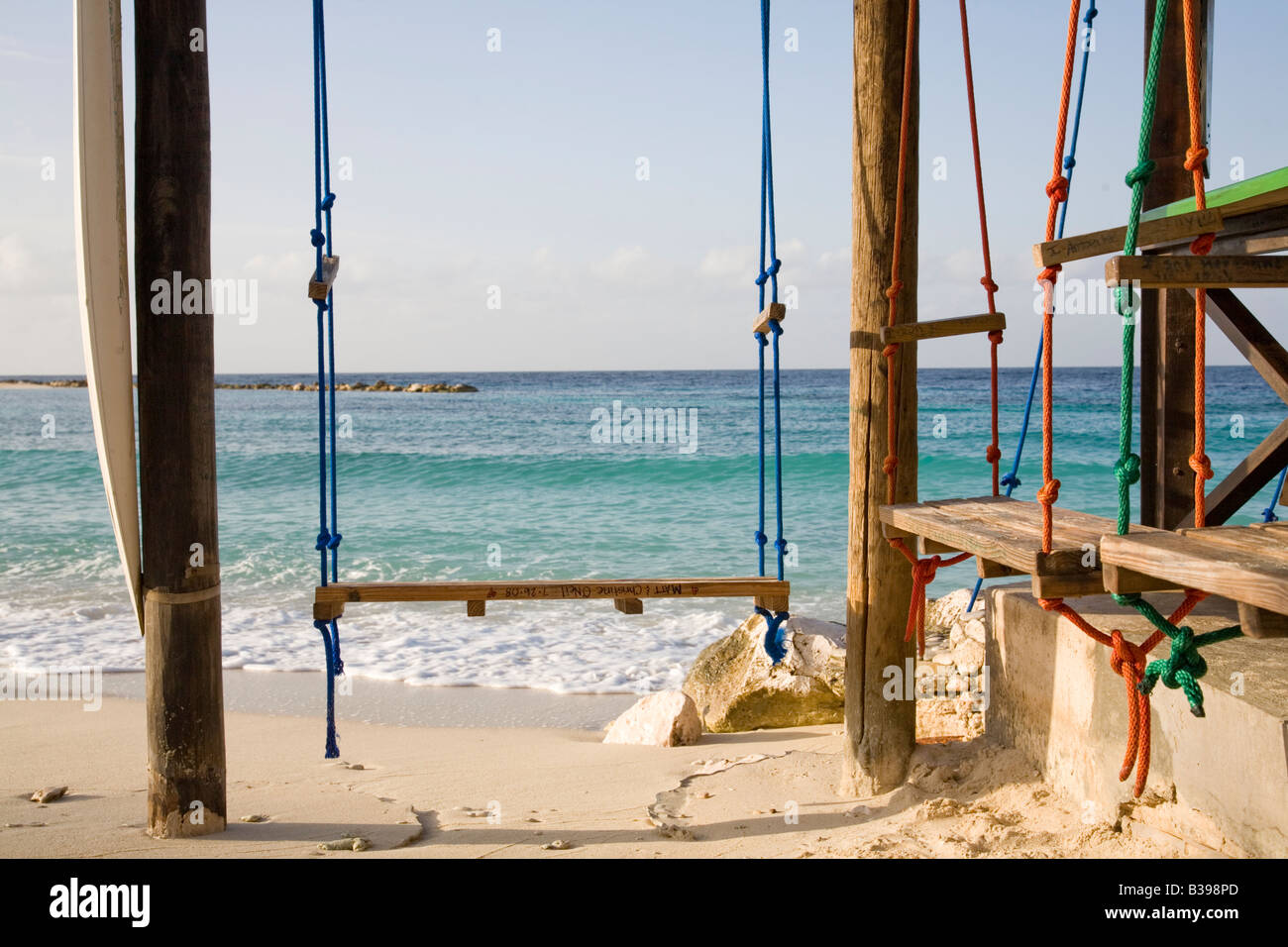 Tropical beach with swing overlooking the ocean Piscadera Curacao ...