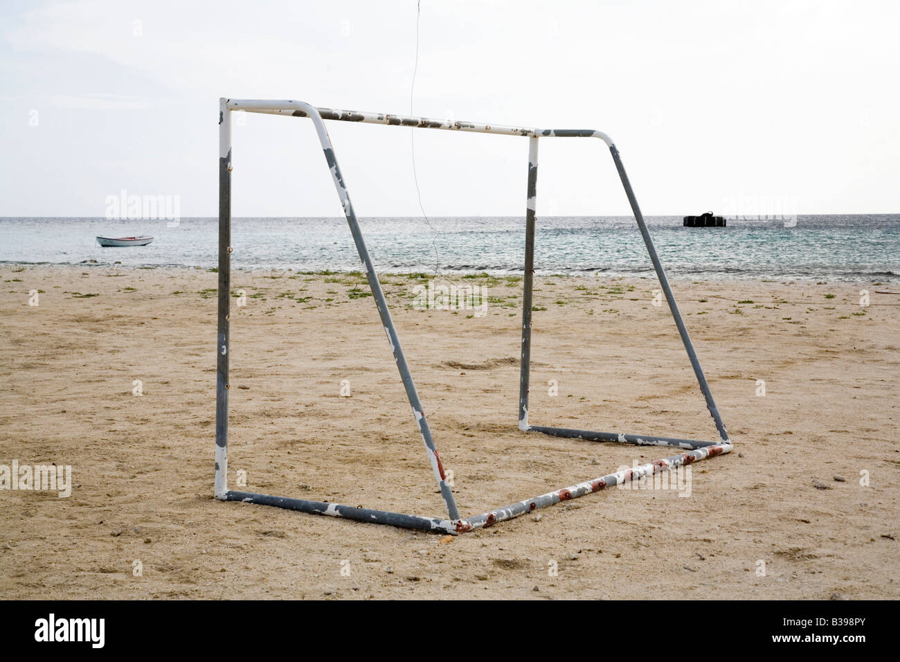 Old rusty soccer goal on empty beach overlooking the ocean Stock Photo ...