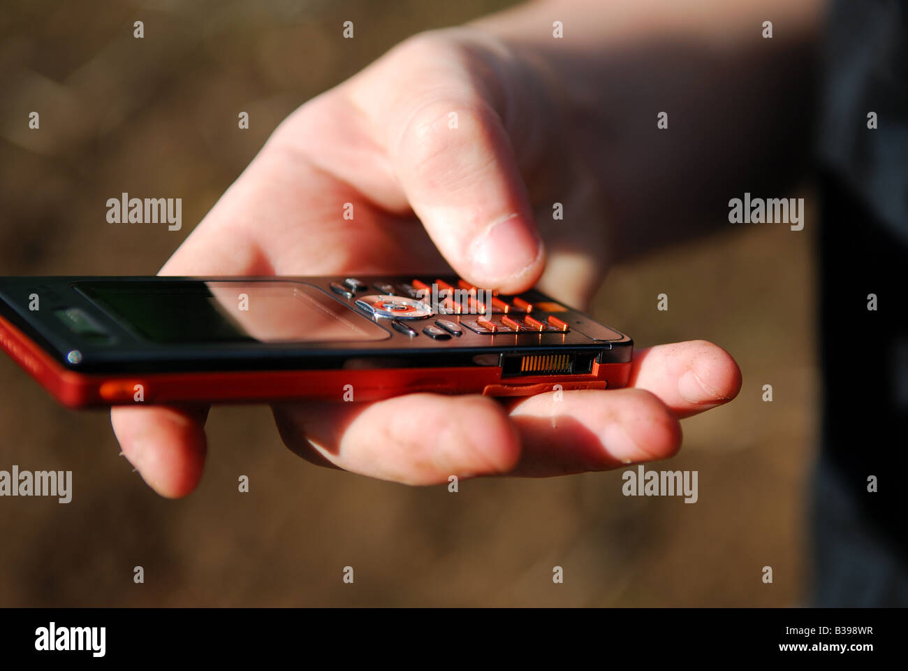 Texting on mobile telephone Stock Photo - Alamy