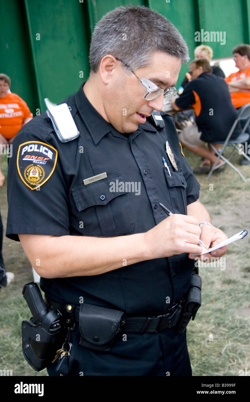 Policeman making notes. Minneapolis Minnesota USA Stock Photo - Alamy