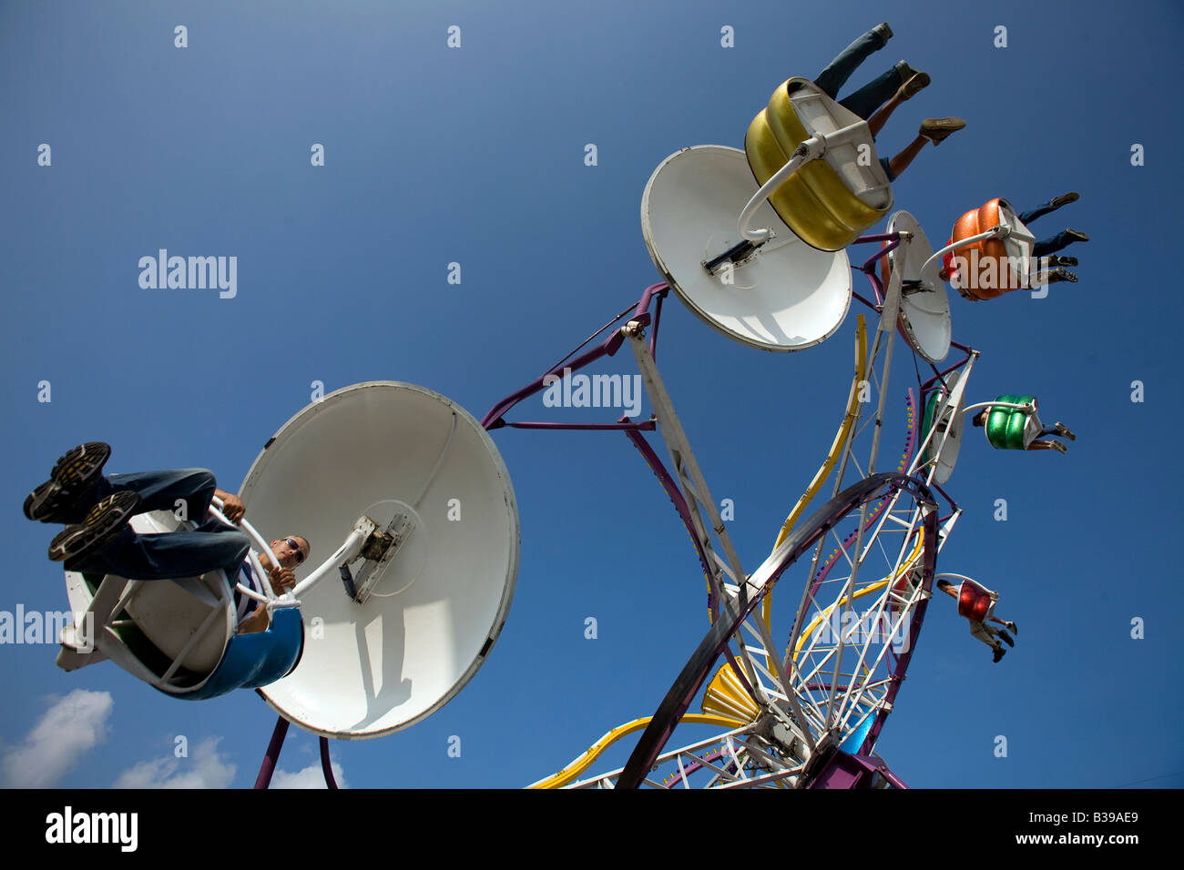 Carnival goers take a spin on the Paratrooper ride during Frisco Fest ...