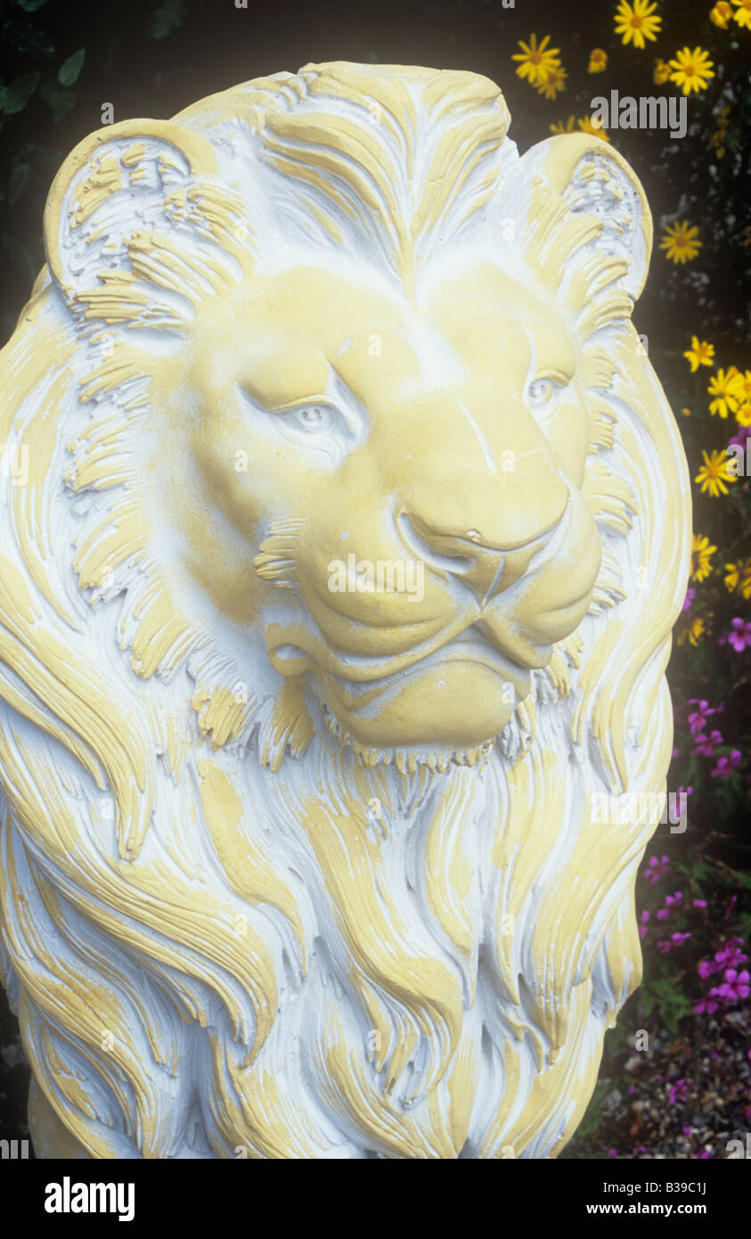 Detail of head and mane of cement lion statue painted cream and white ...