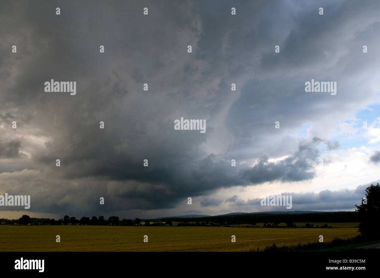 Storm over farmland Stock Photo - Alamy