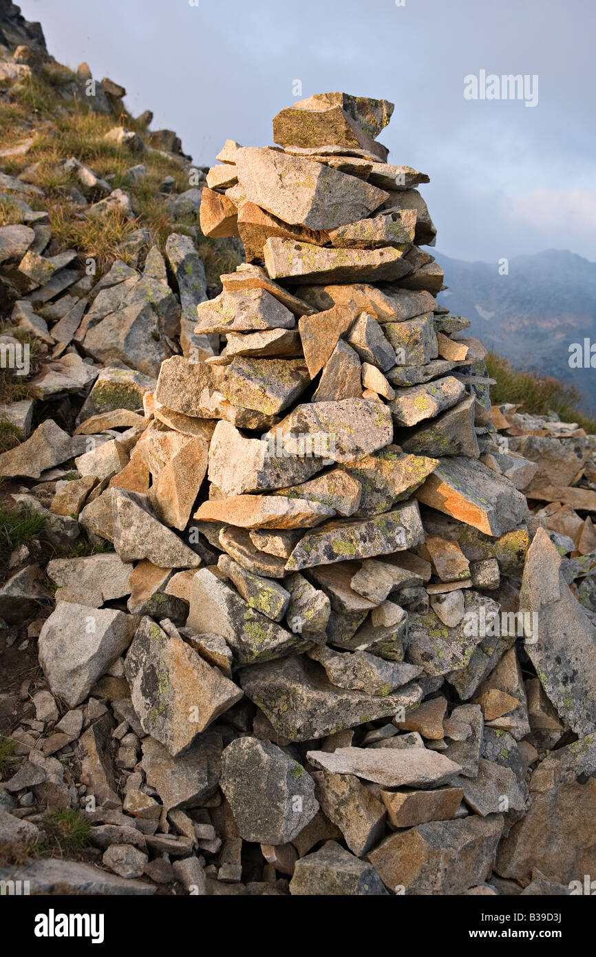 Pile of rocks on marked path in World Heritage Site Pirin National Park ...