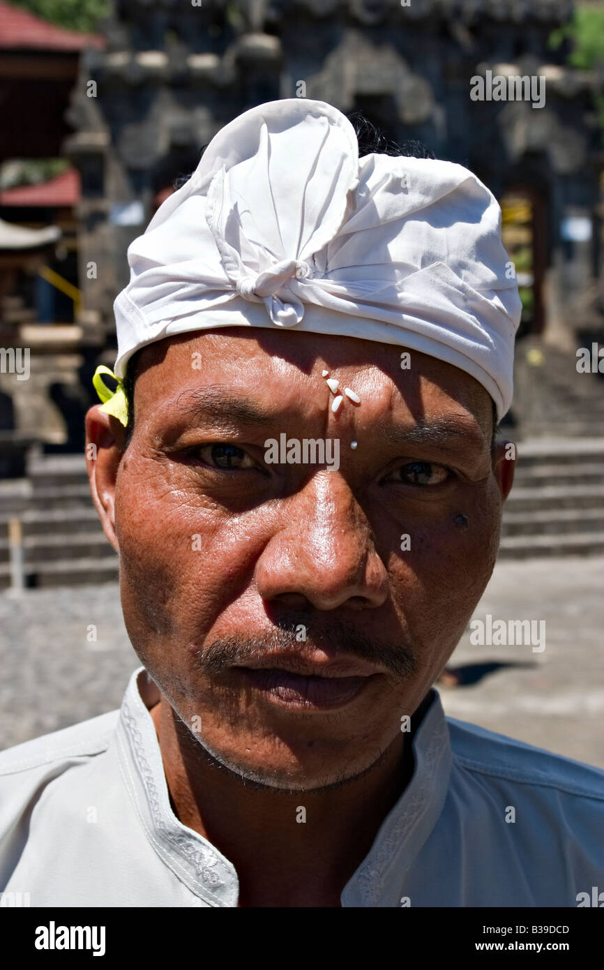 Indonesian man with rice on his forehead in Pura Pulaki, Bali ...