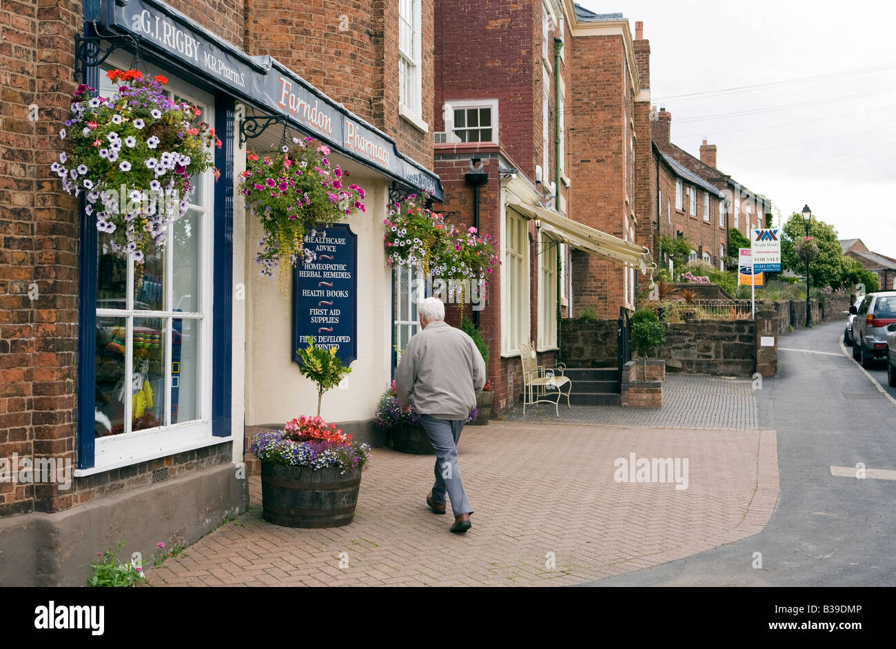UK Cheshire Farndon High Street Rigbys Pharmacy and Paul Burrells ...