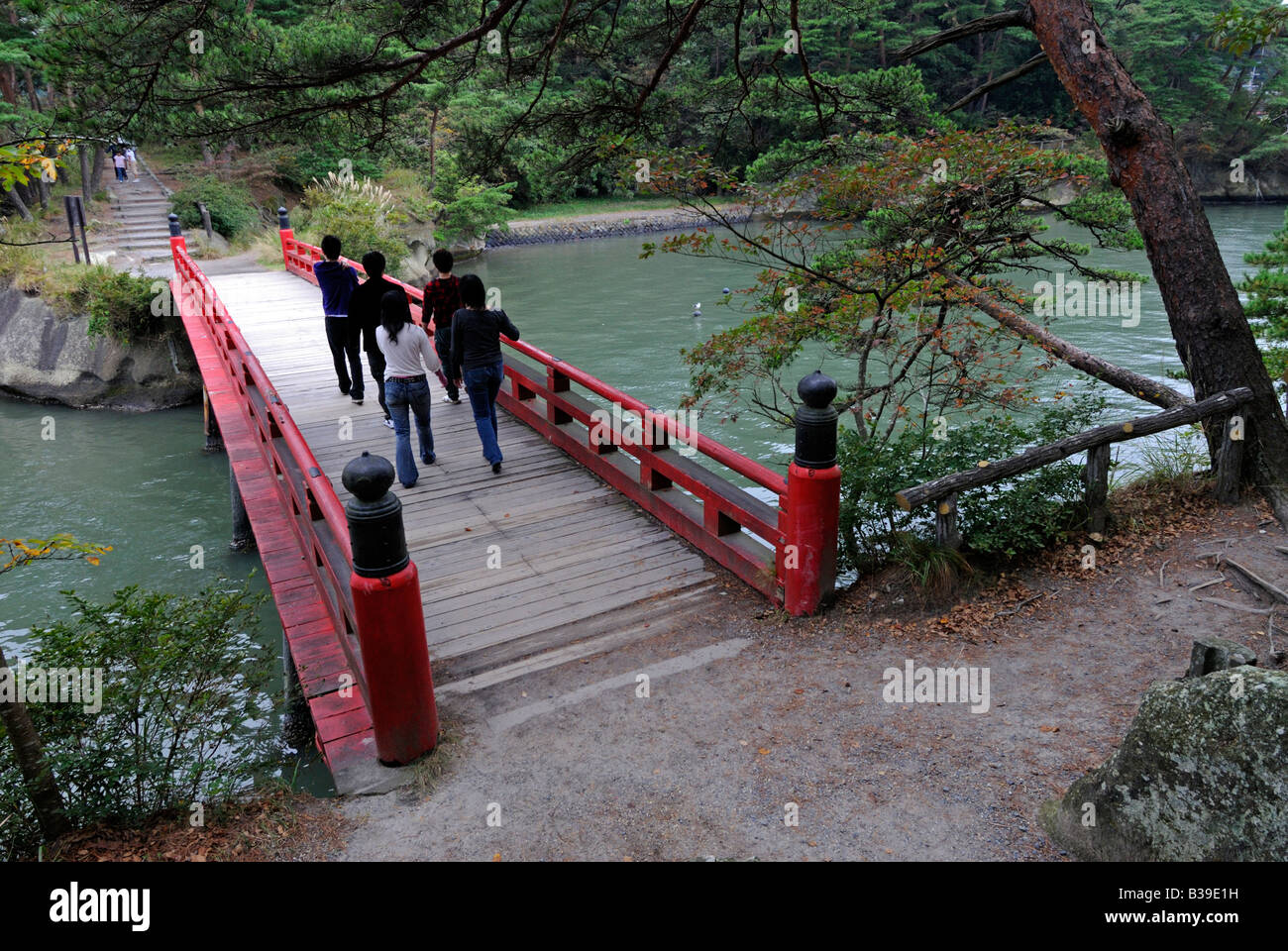 Japanese tourists crossing wooden bridge to Oshima island Matsushima ...