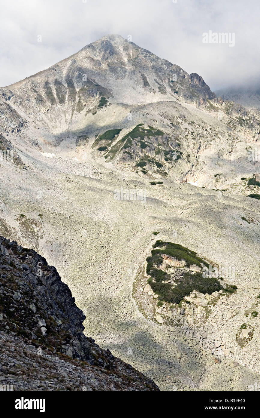 Majestic Polejan peak surrounded by clouds in World Heritage Site Pirin ...