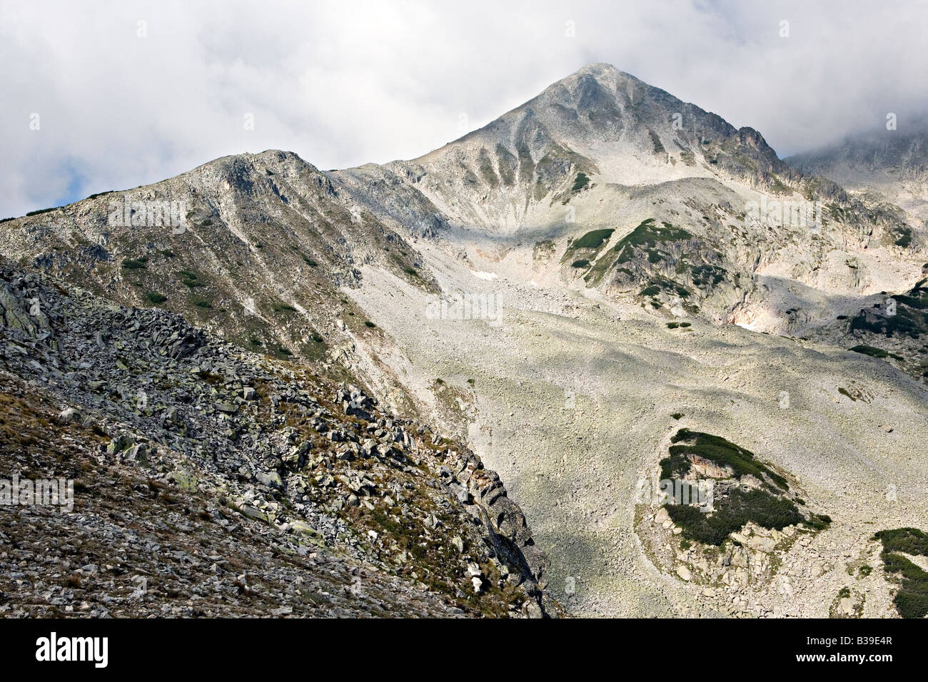 Majestic Polejan peak surrounded by clouds in World Heritage Site Pirin ...