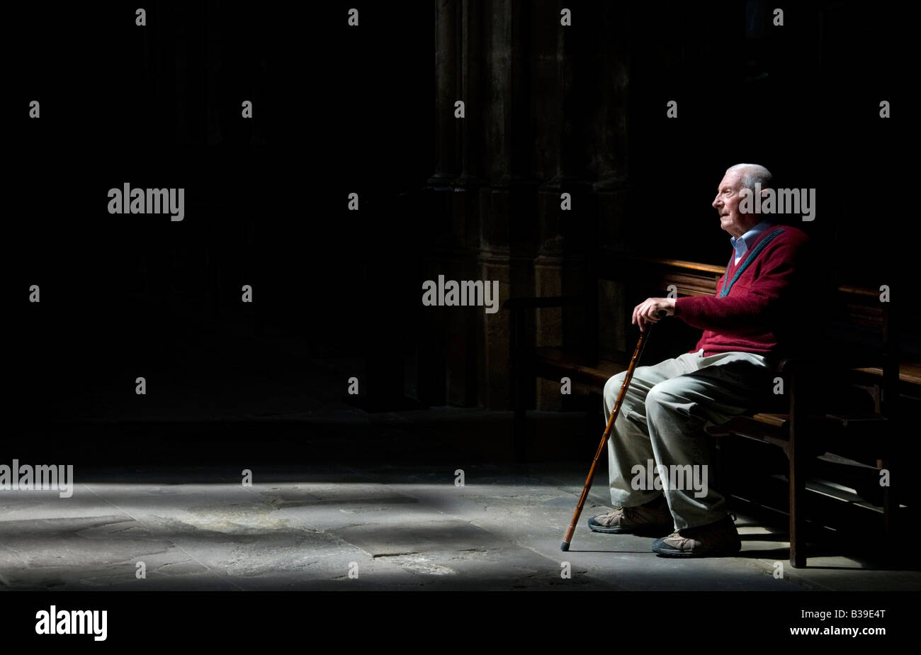 Praying in the light Stock Photo - Alamy