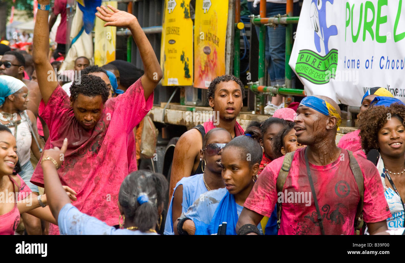 people covered in chocolate dancing in the parade behind the No Knives ...
