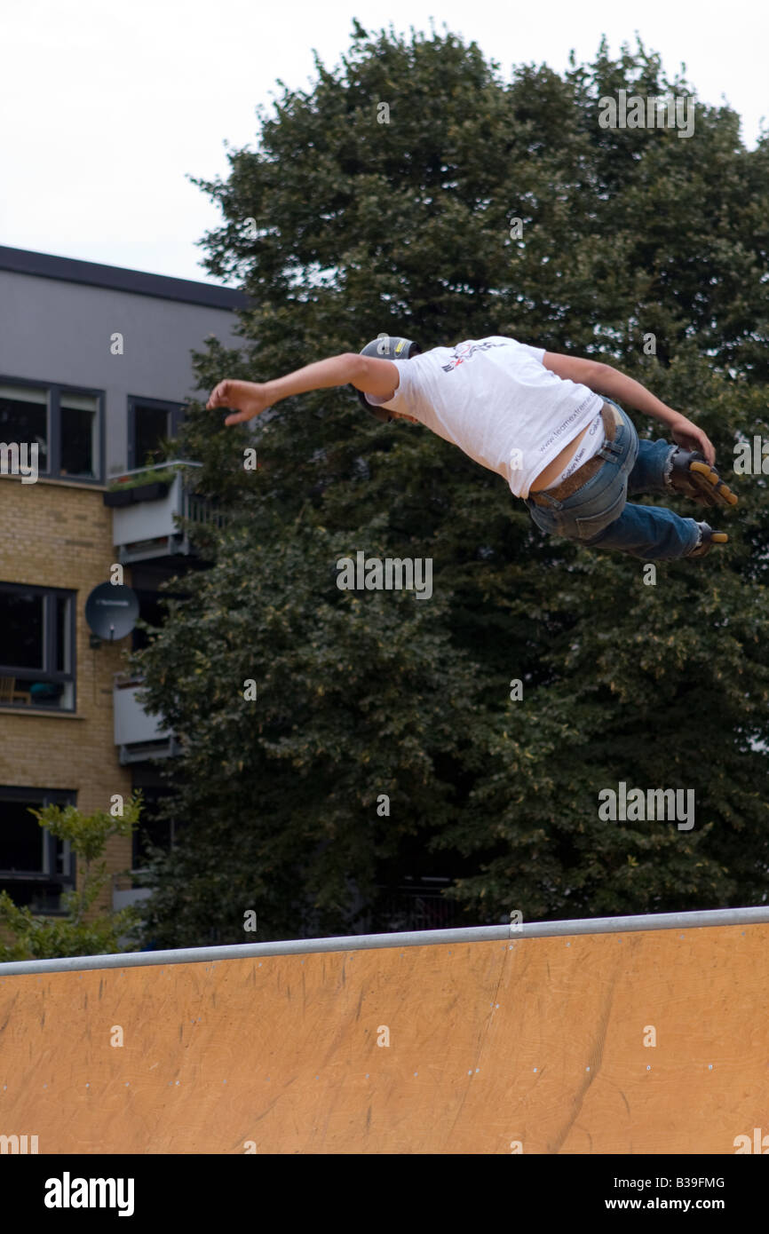 A member of Extreme Team performs a trick on a half pipe Stock Photo ...
