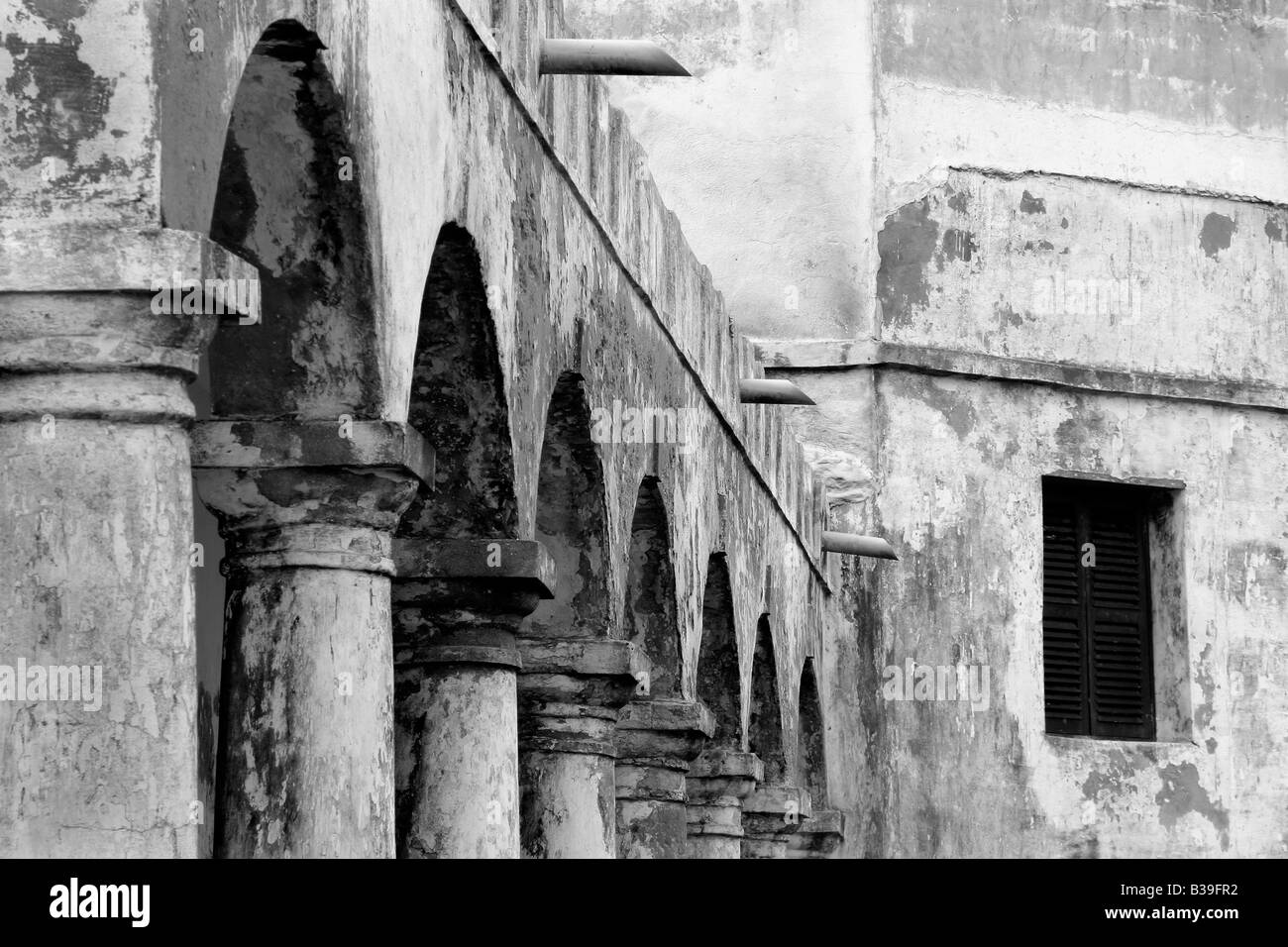 Pillars and arches lead to castle window in Ghana, Africa Stock Photo ...