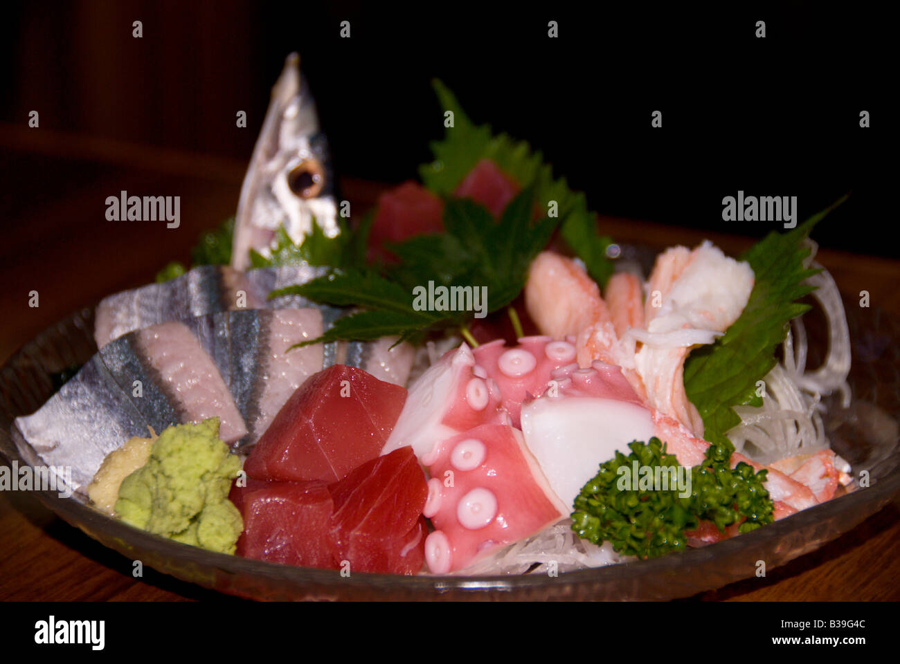 A platter of fresh assorted sashimi at an izakaya restaurant in central ...