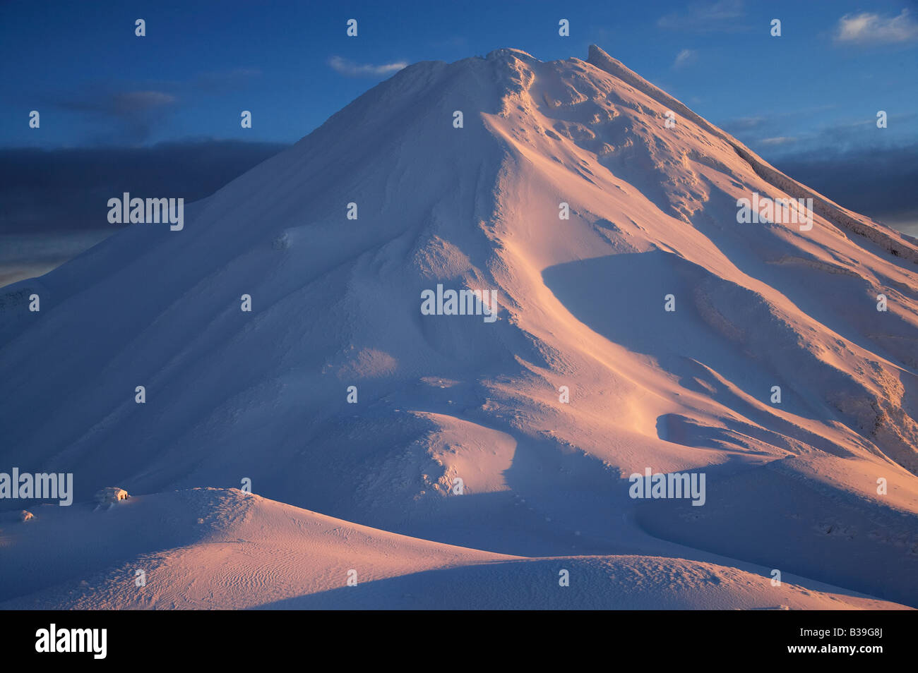 Syme Hut at left Fanthams Peak and Alpenglow at Dawn on Mt Taranaki Mt ...