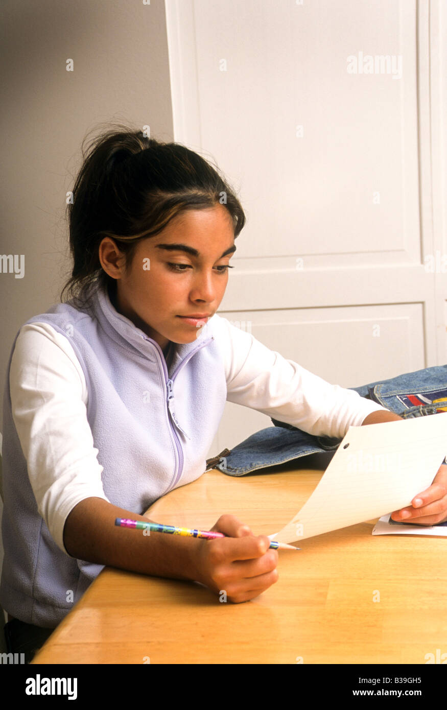 Hispanic junior high school girl does homework at home Stock Photo - Alamy