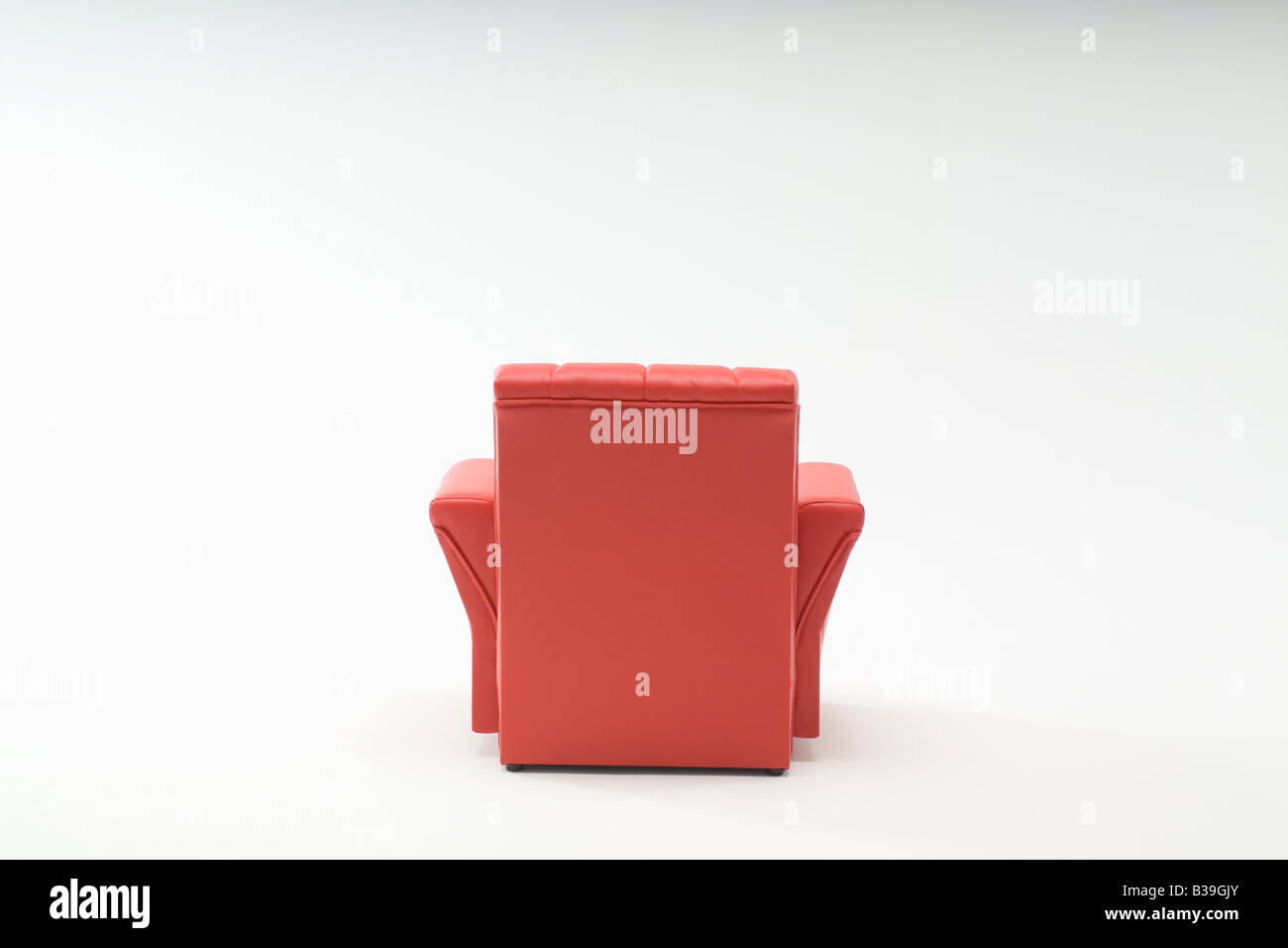 Rear view of red sofa Stock Photo - Alamy