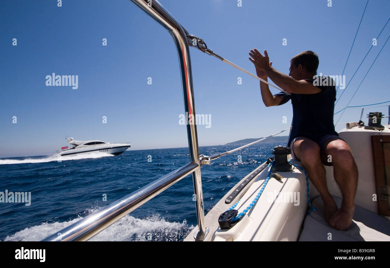 Sarcastic applause from a sailor as another motor boat roars by Stock ...