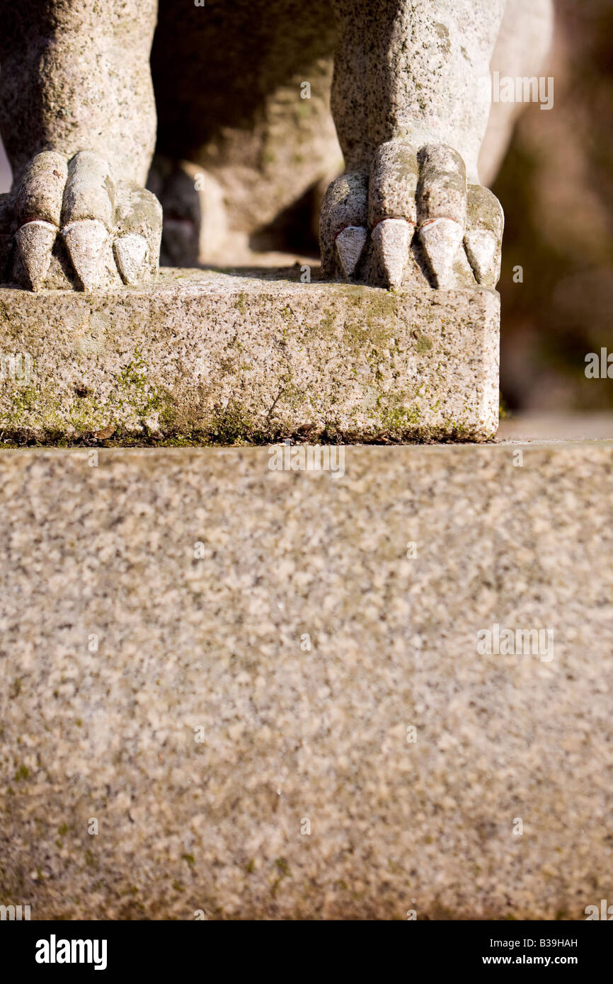 Legs of stone statue Stock Photo - Alamy