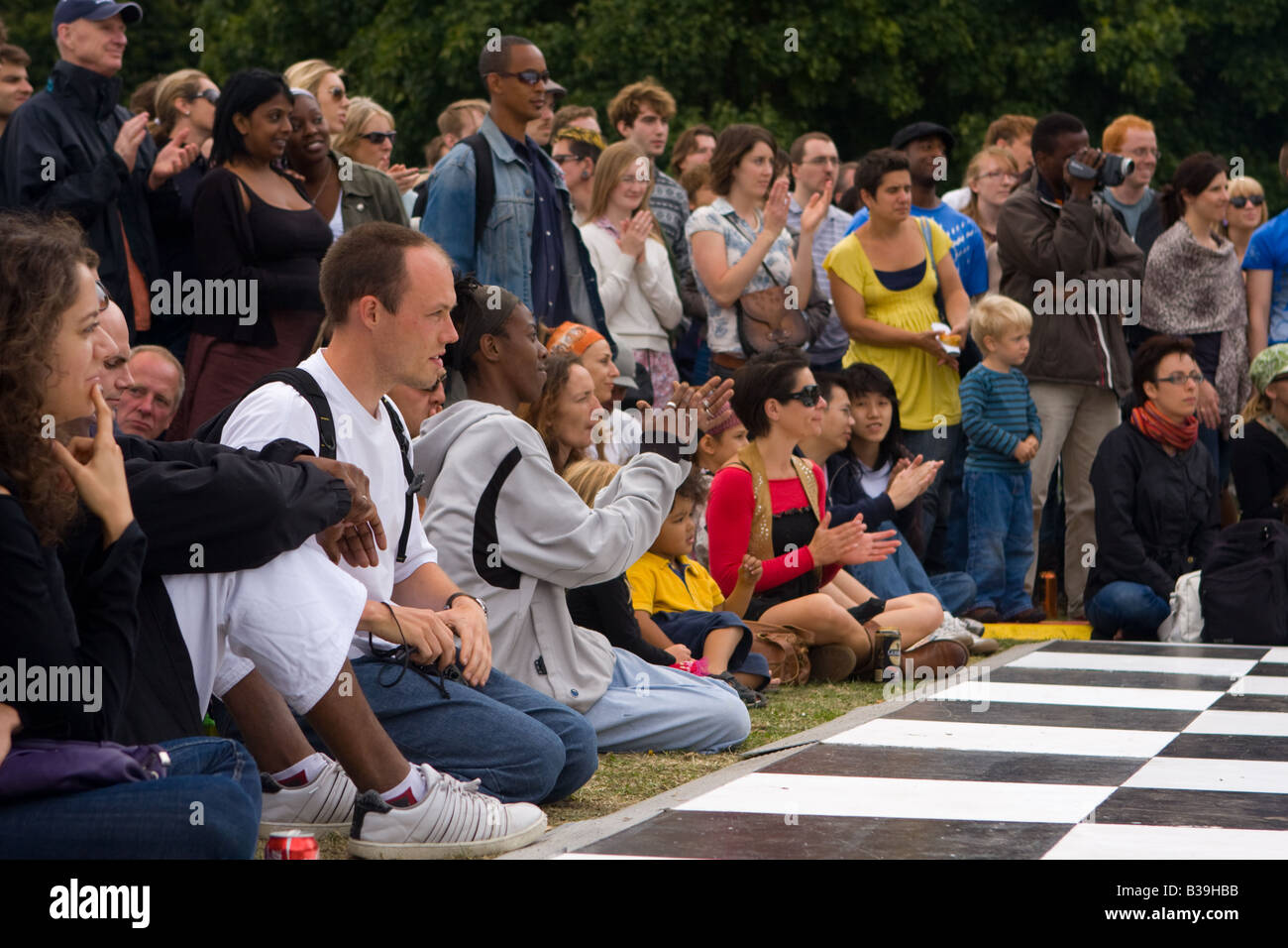A crowd of people watching a break dancing routine at Shoreditch ...