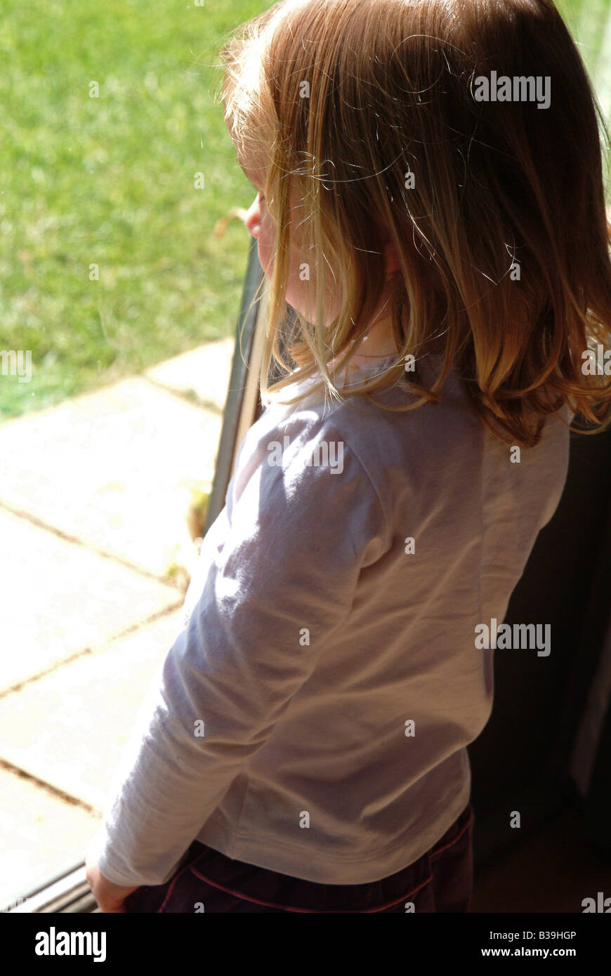 Little girl looking wistful Stock Photo - Alamy