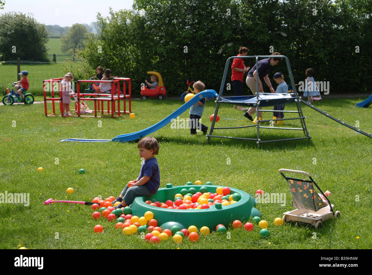 Little children in play area Stock Photo - Alamy