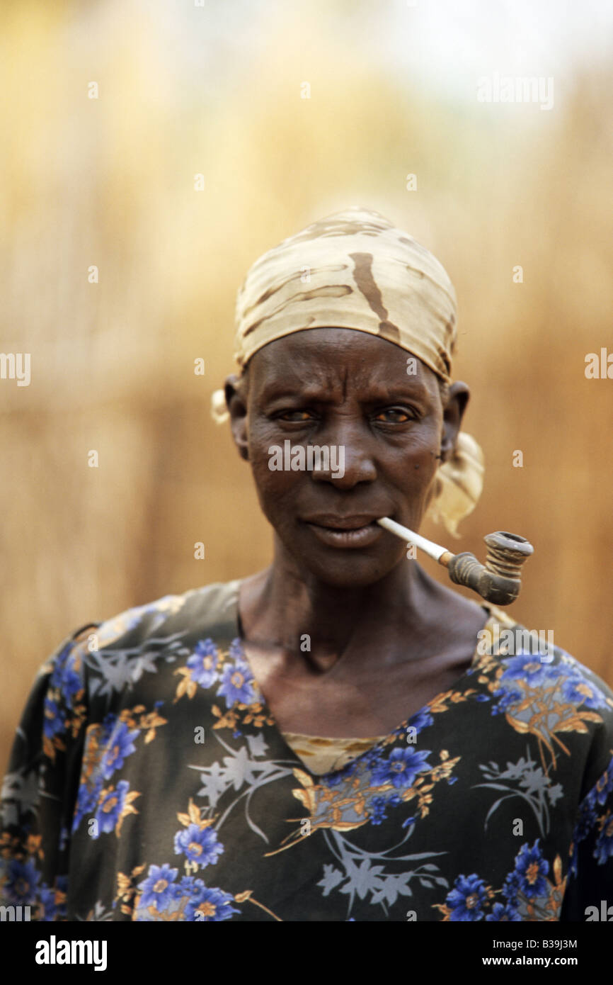 Old woman smoking pipe hi-res stock photography and images - Alamy