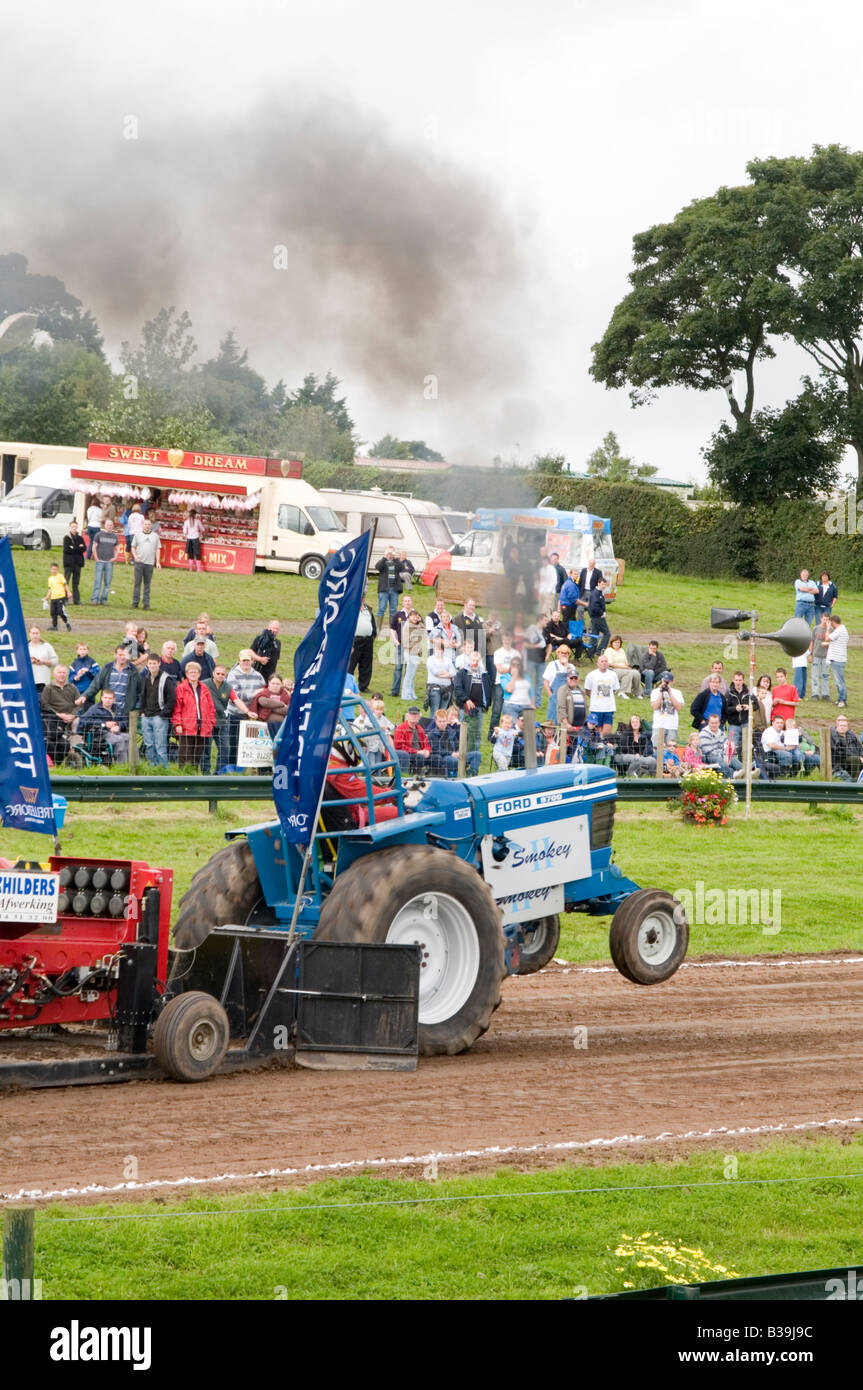 Diesel black smoke engine tractor pulling Stock Photo - Alamy