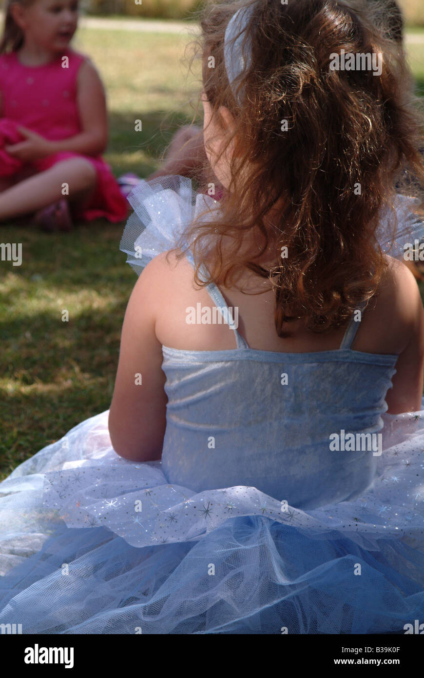 Rear view of a little girl wearing a white tutu costume Stock Photo - Alamy