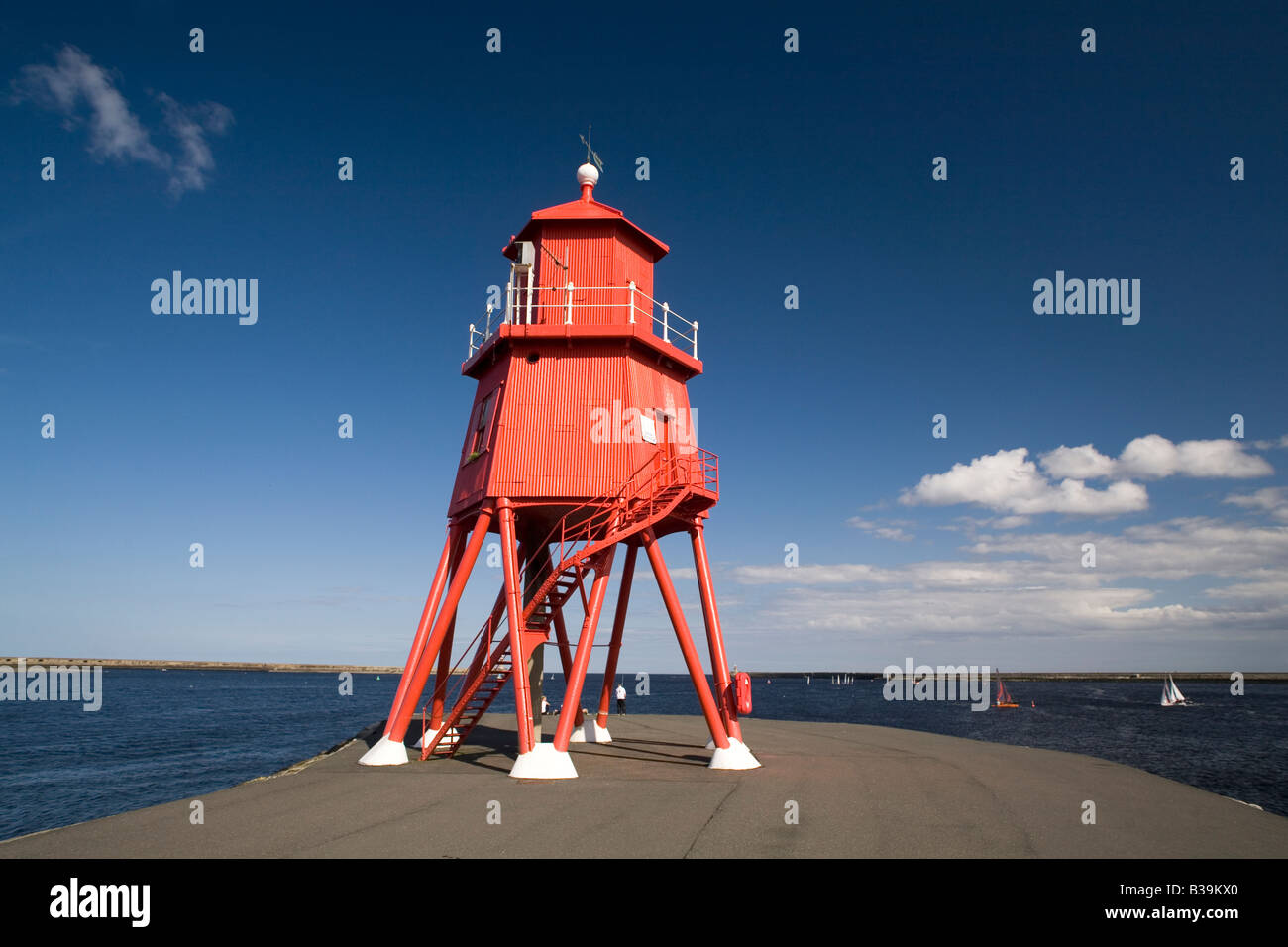 The Groyne Lighthouse in South Shields, England. The red lighthouse is ...
