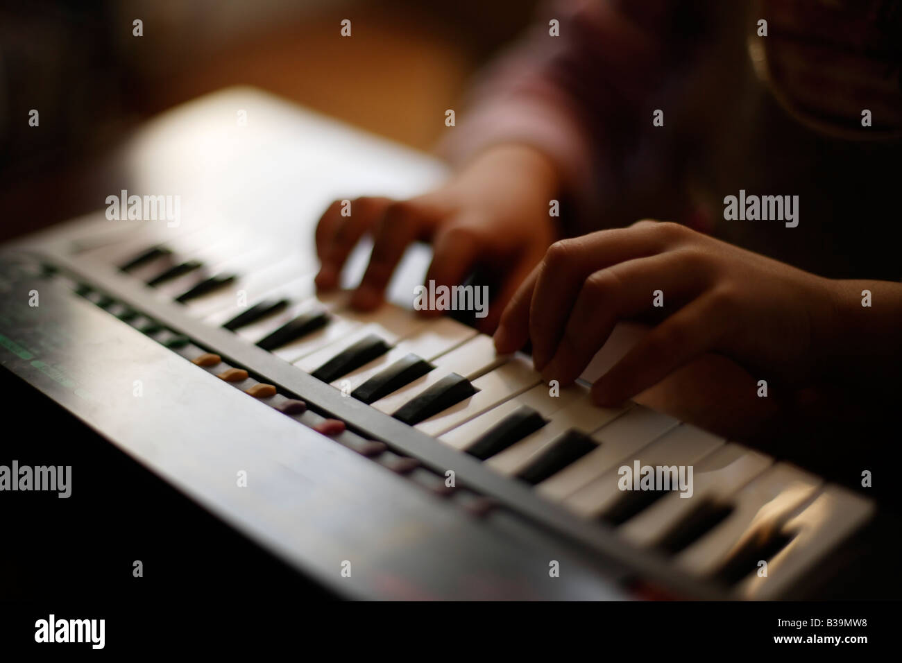 Girl with electric keyboard Stock Photo - Alamy