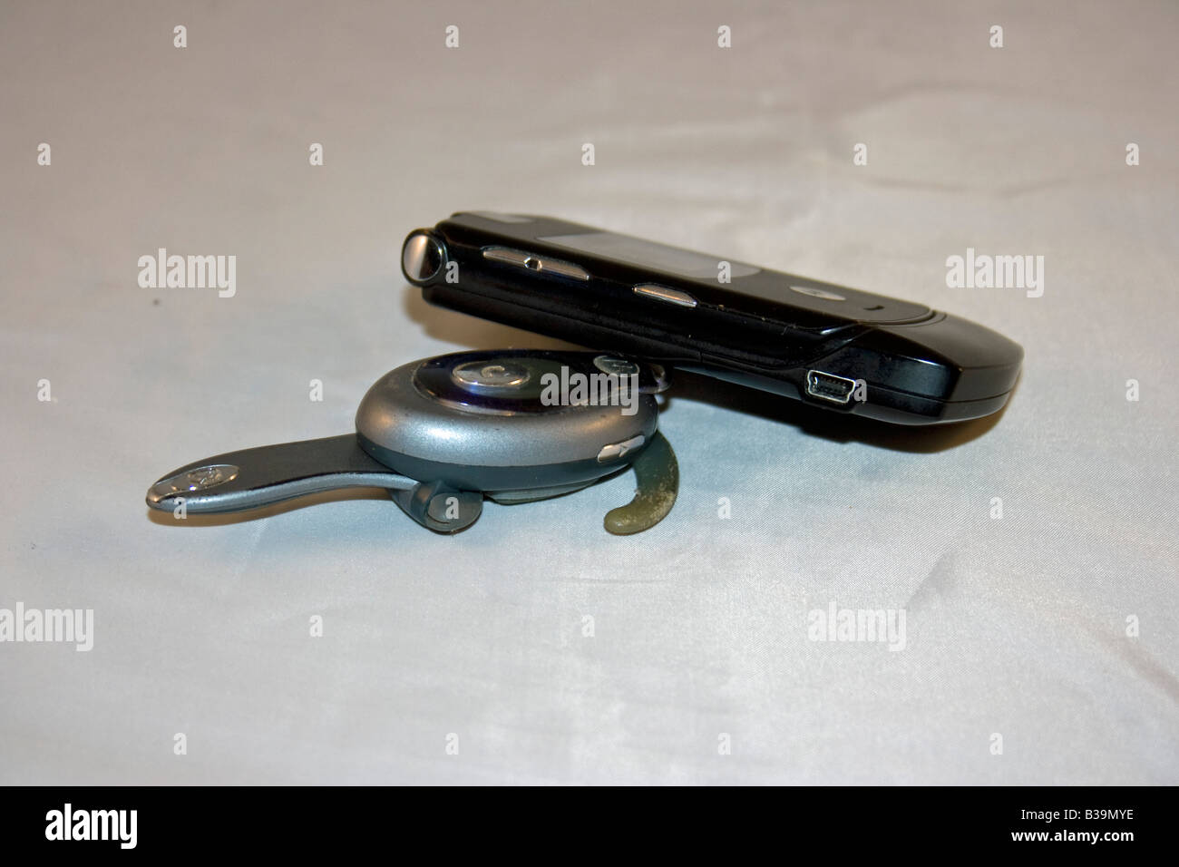 Silo Cell Phone and Bluetooth Ear Piece Stock Photo - Alamy