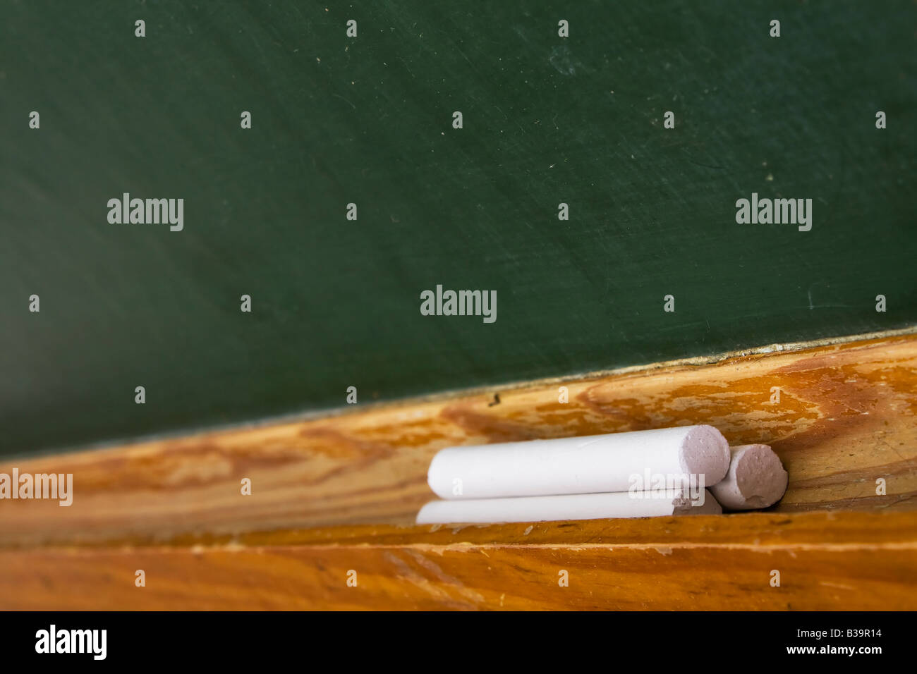 Detail of chalk sticks in a school board Stock Photo - Alamy