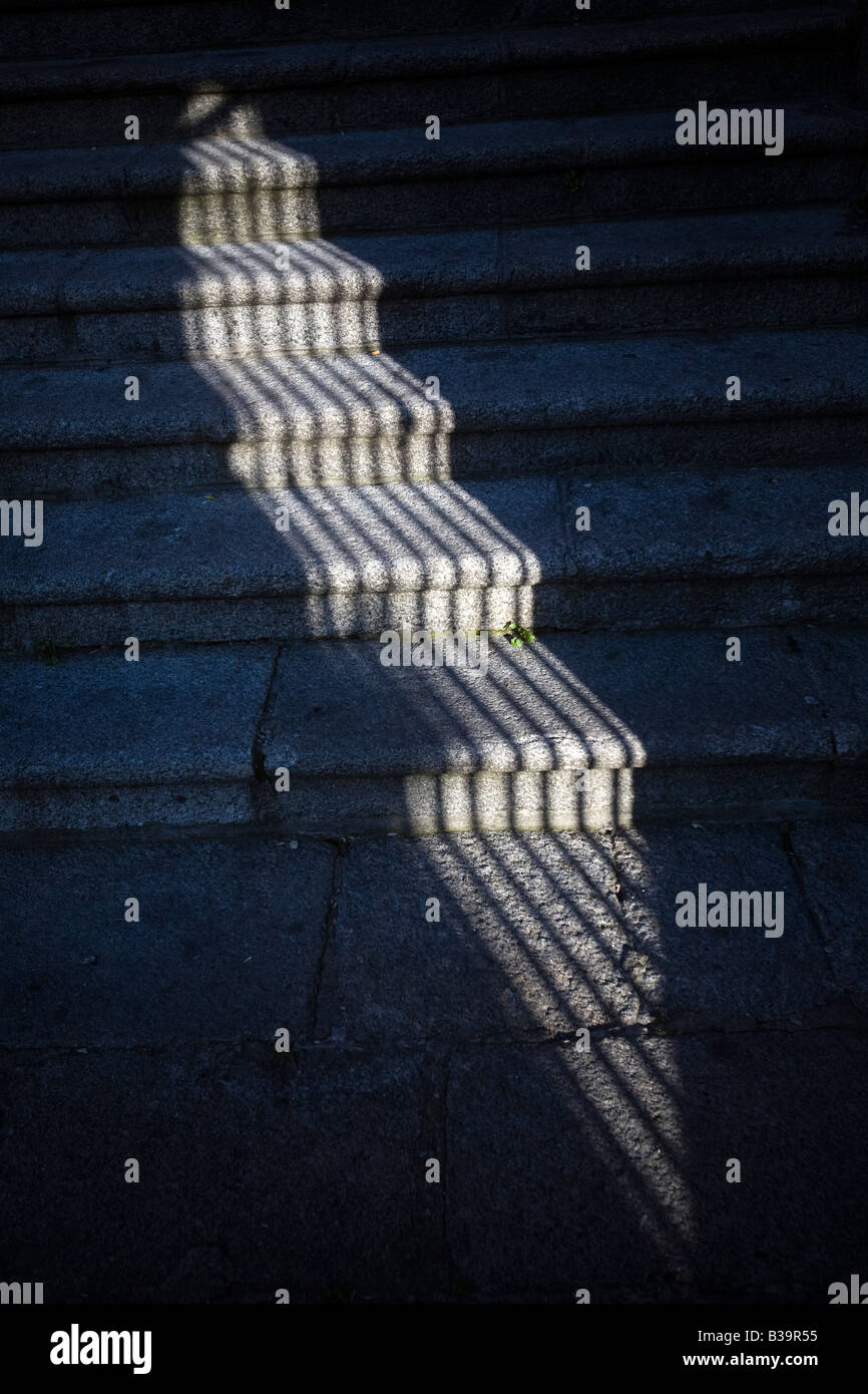 The shadow of a window grille on stone steps, Caceres, Spain Stock ...