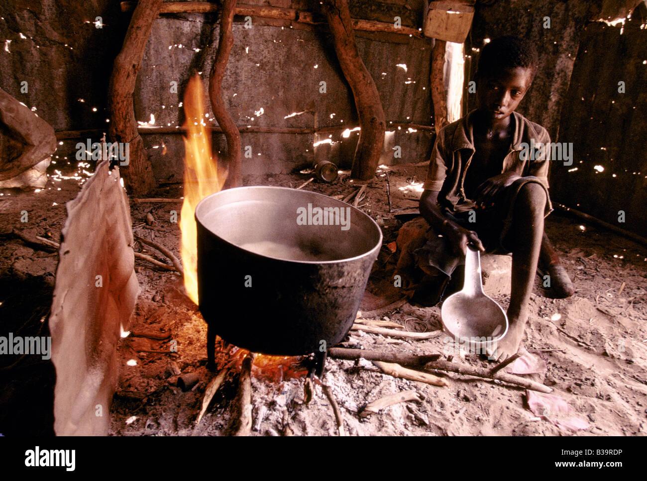 'TOUBA, AFRICA'S LITTLE MECCA', YOUNG BOY COOKS FOR THE REST OF THE ...
