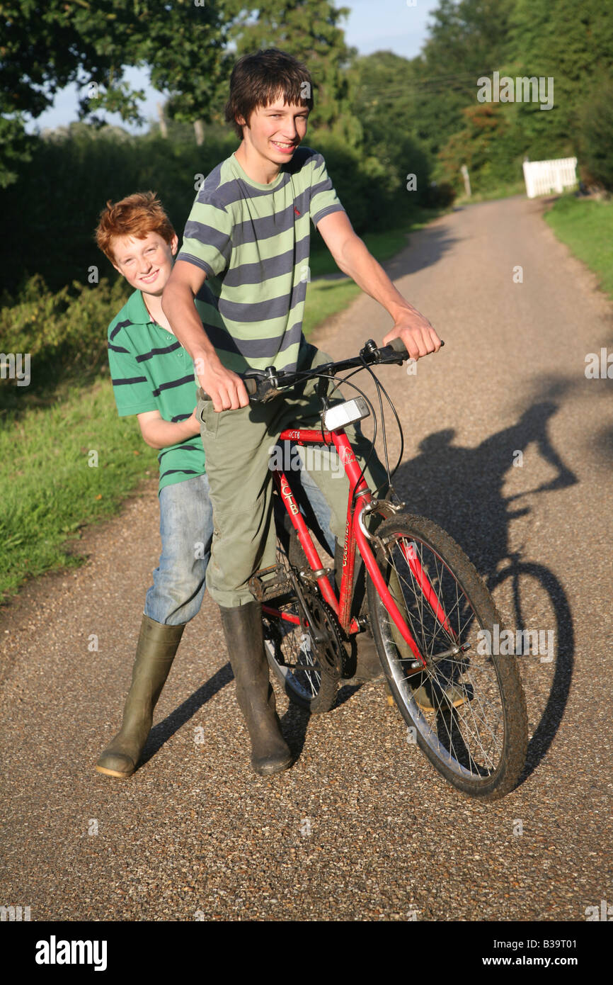 Boys playing with their bicycle hi-res stock photography and images - Alamy