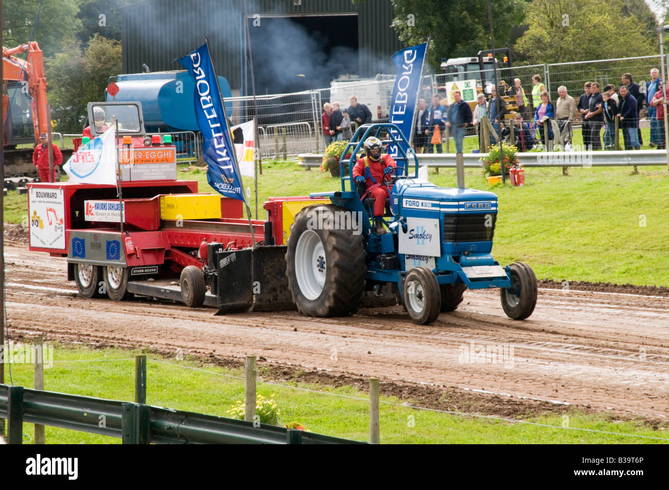 Diesel black smoke engine tractor pulling Stock Photo - Alamy